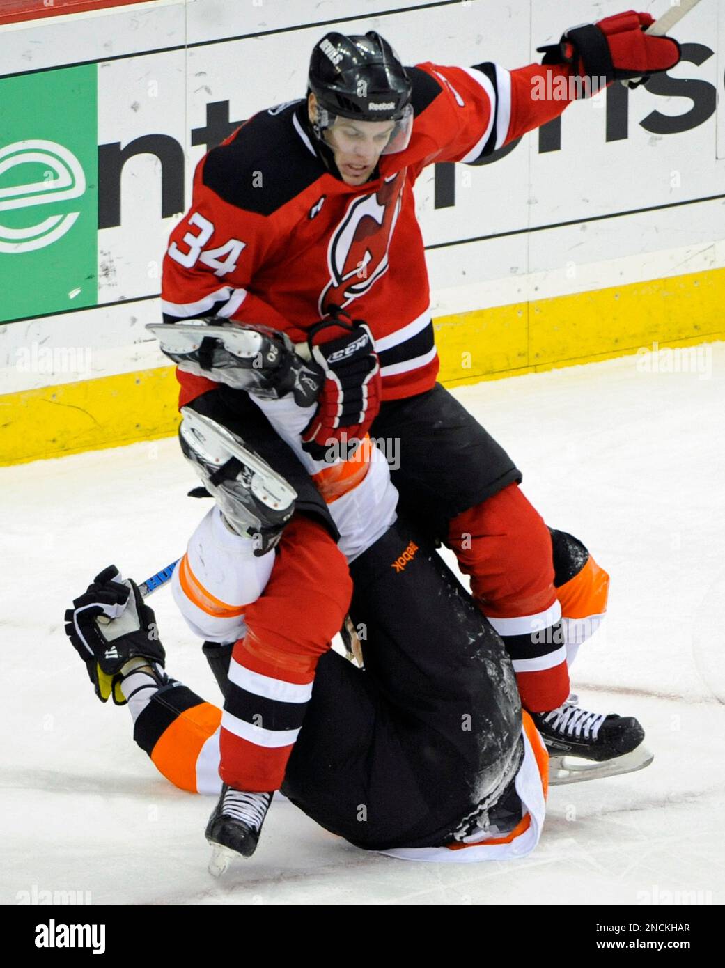 New Jersey Devils' Mark Fayne (34) gets tangled with Philadelphia ...