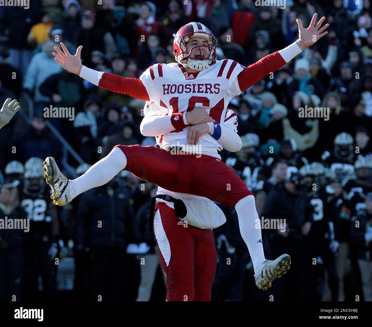 Indiana kicker Mitch Ewald celebrates in the arms of holder Teddy ...