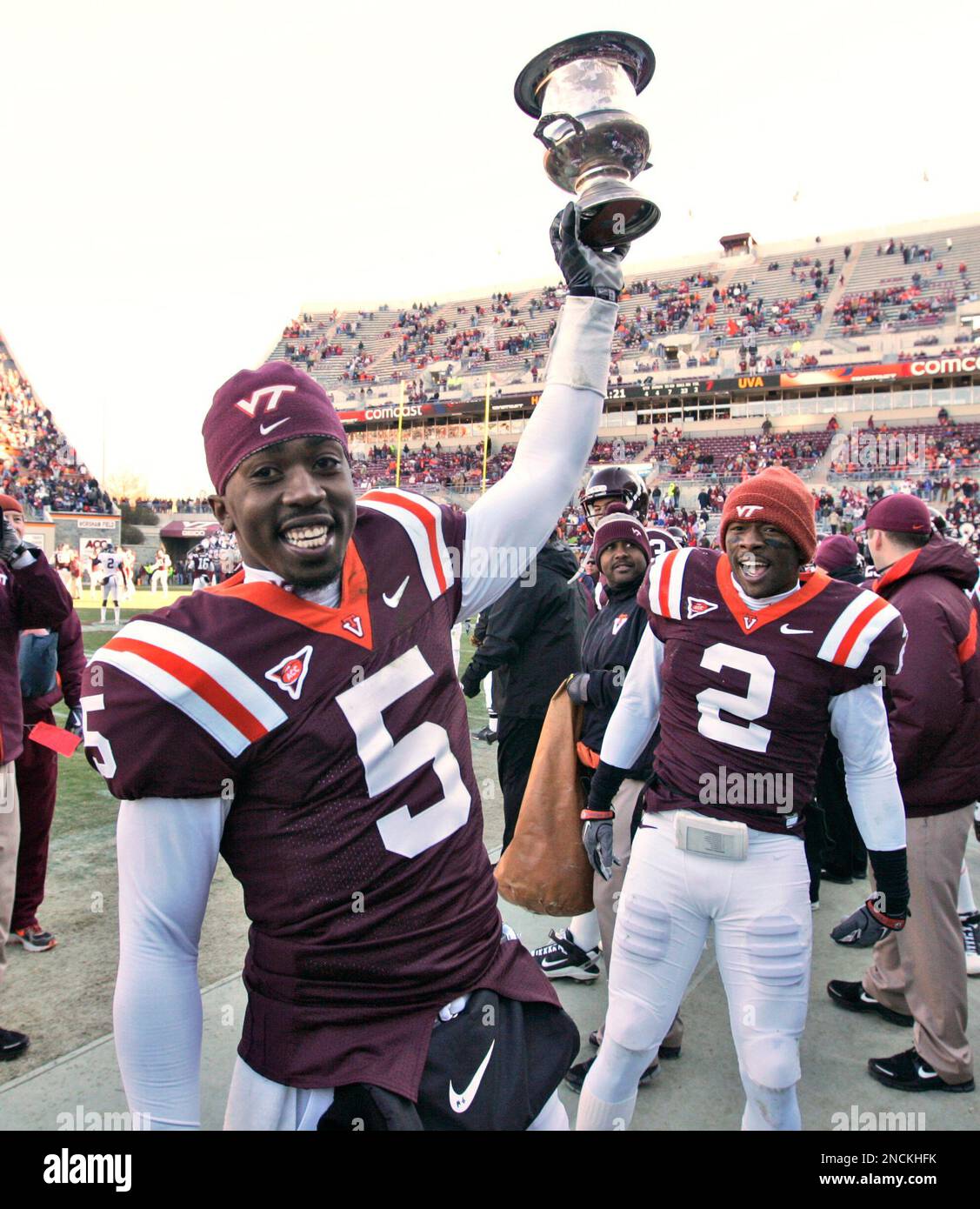 Virginia Tech quarterback Tyrod Taylor (5) holds the Commonwealth Cup ...