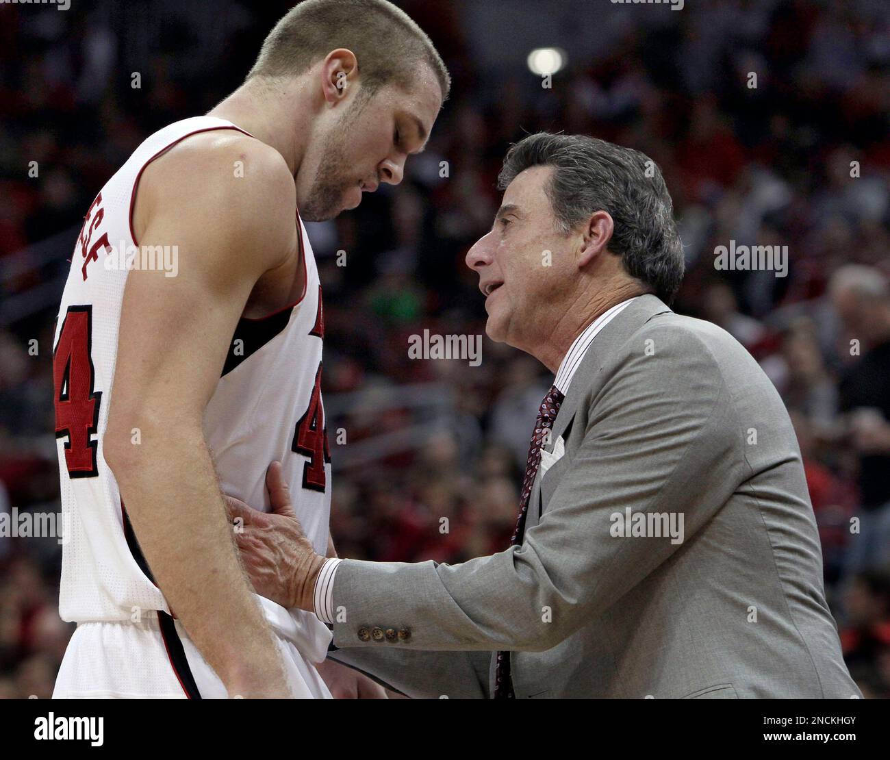 Louisville coach Rick Pitino, right, talks with Stephan Van Treese (44 ...