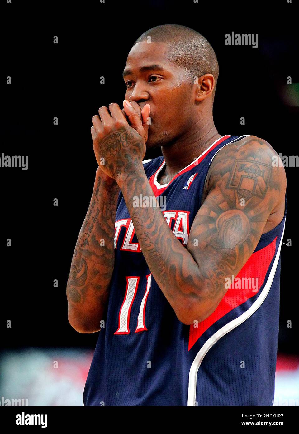 Atlanta Hawks' Jamal Crawford (11), a former Knick, blows on his hands ...