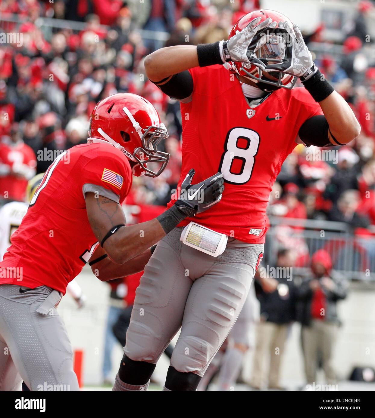 Ohio State wide receiver DeVier Posey (8) celebrates with teammate wide ...