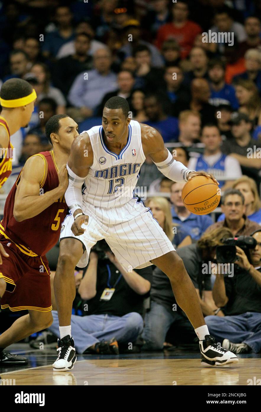 Orlando Magic center Dwight Howard (12) moves to the basket in front of ...