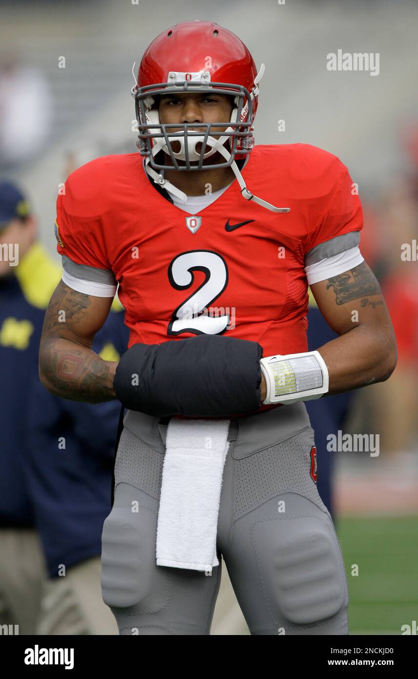 Ohio State quarterback Terrelle Pryor (2) keeps warm before taking on ...