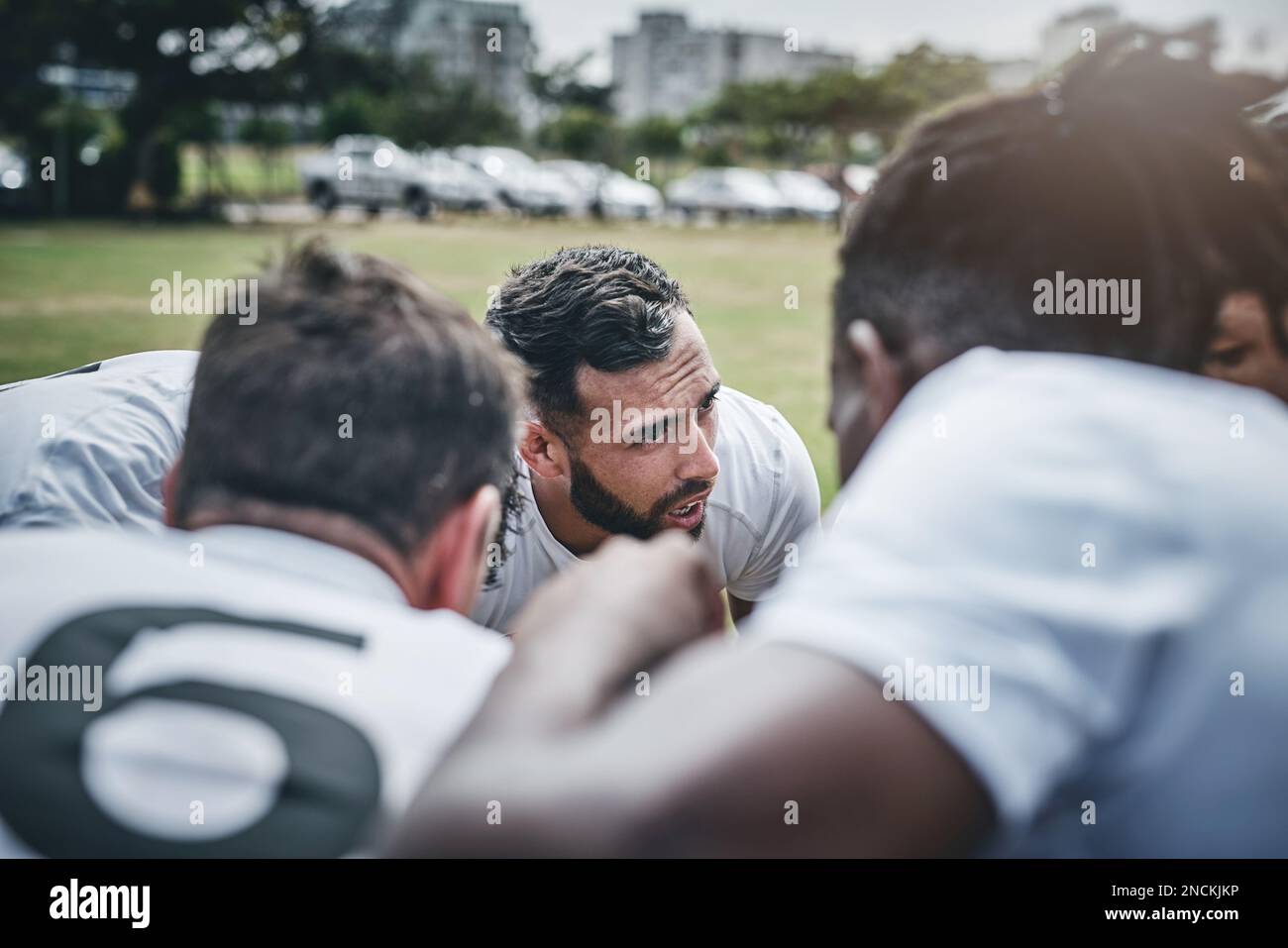 Just stick to the game plan. a focused young rugby team forming a ...