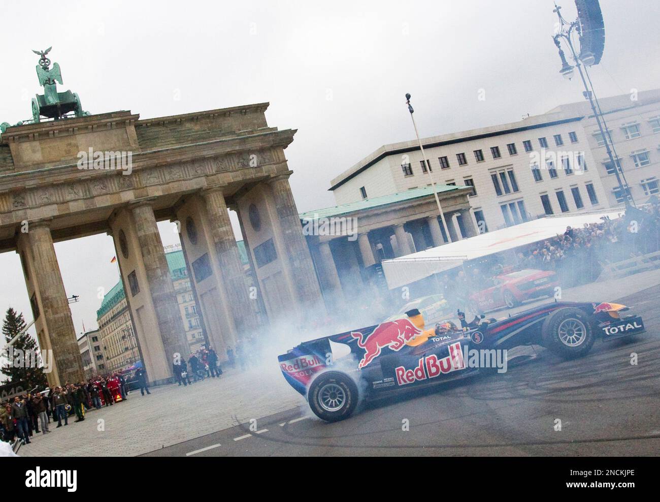 Red Bull F1 driver Sebastian Vettel of Germany spins his car in front ...