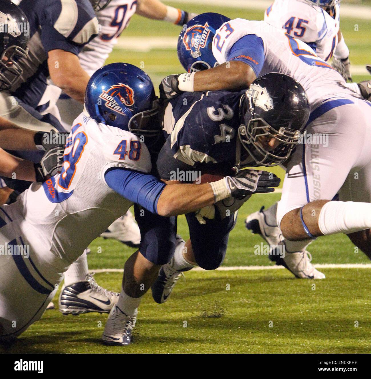 Nevada Wolf Pack running back Vai Taua pushes through the Boise State ...