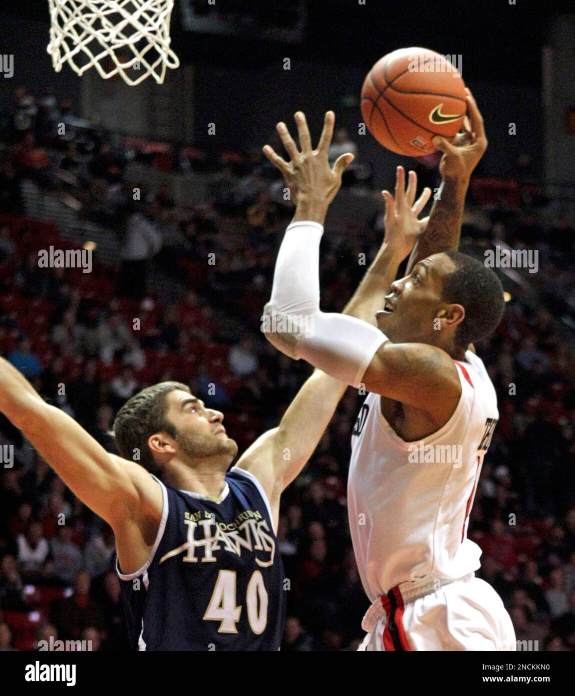 San Diego State's Malcolm Thomas shoots over San Diego Christian's ...