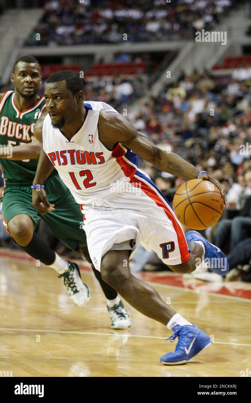 Detroit Pistons' Will Bynum, right, drives past Milwaukee Bucks' Keyon ...