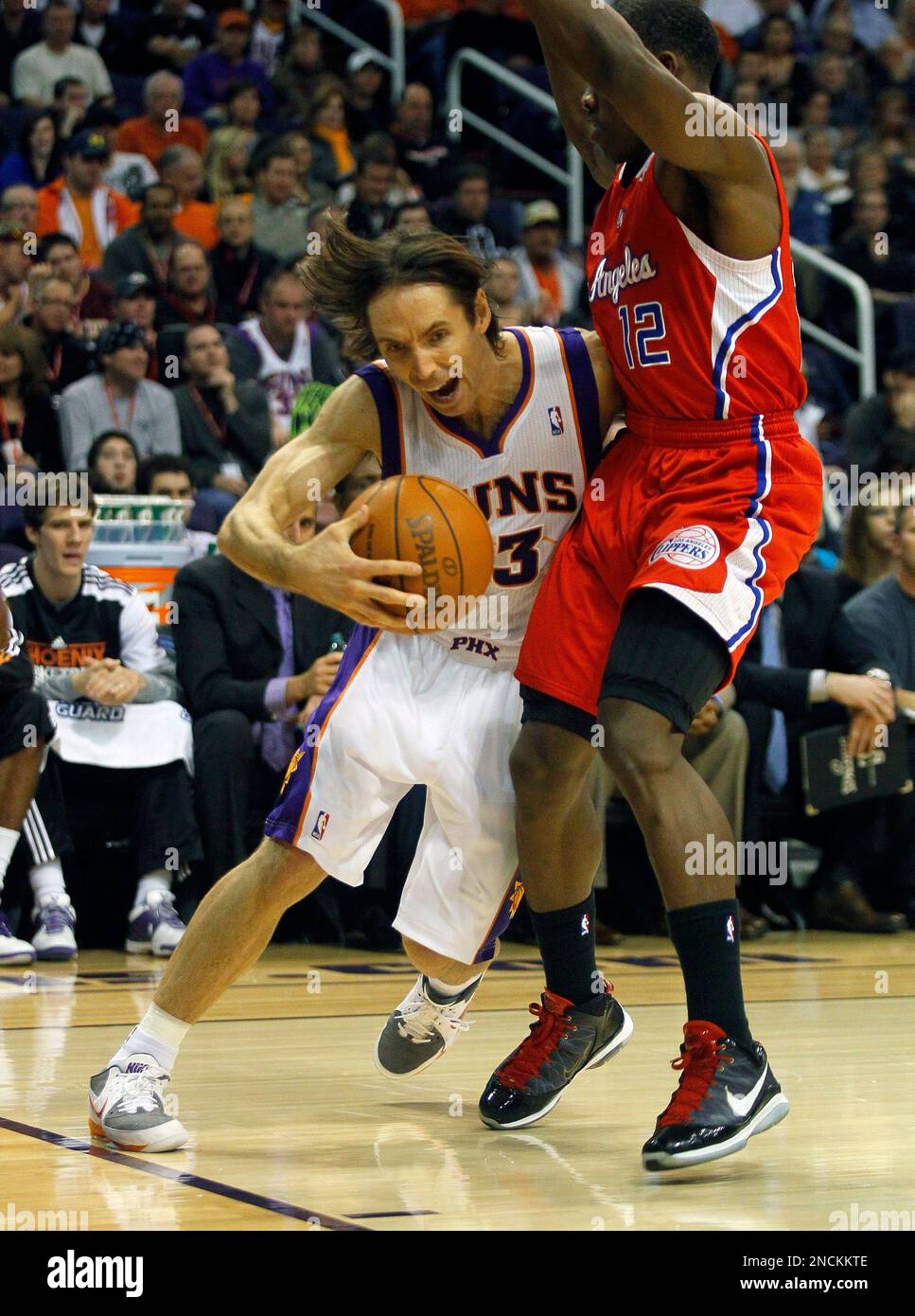 Phoenix Suns guard Steve Nash, left, draws the foul on Los Angeles ...