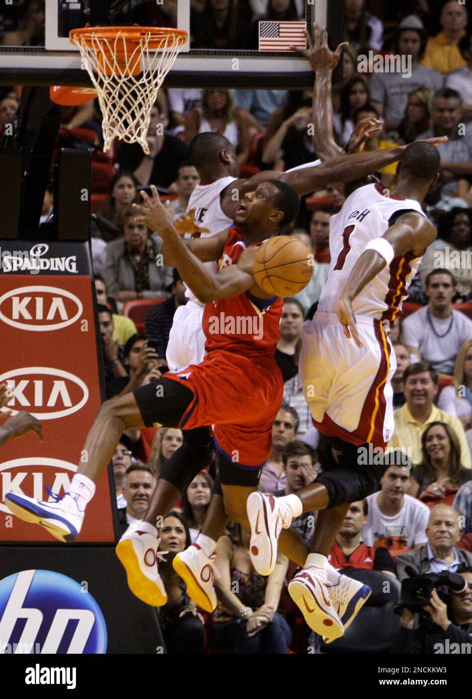 Philadelphia 76ers' Thaddeus Young (21) is fouled by Miami Heat's ...