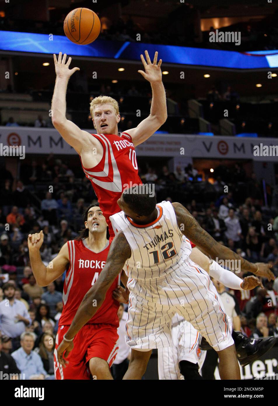 Houston Rockets' Chase Budinger (10) loses the ball as he runs into ...