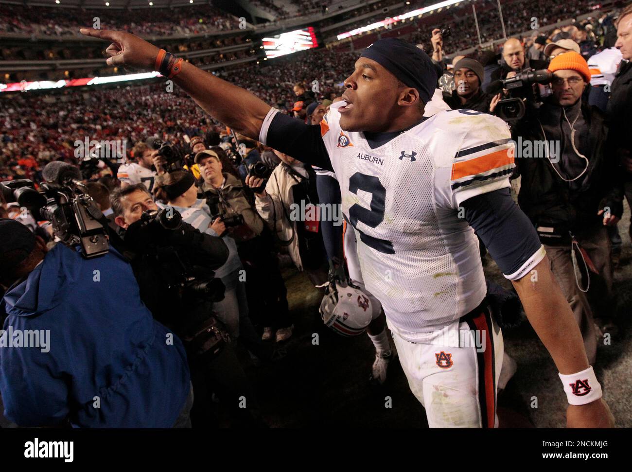 Auburn quarterback Cameron Newton celebrates after their 28-27 win over ...