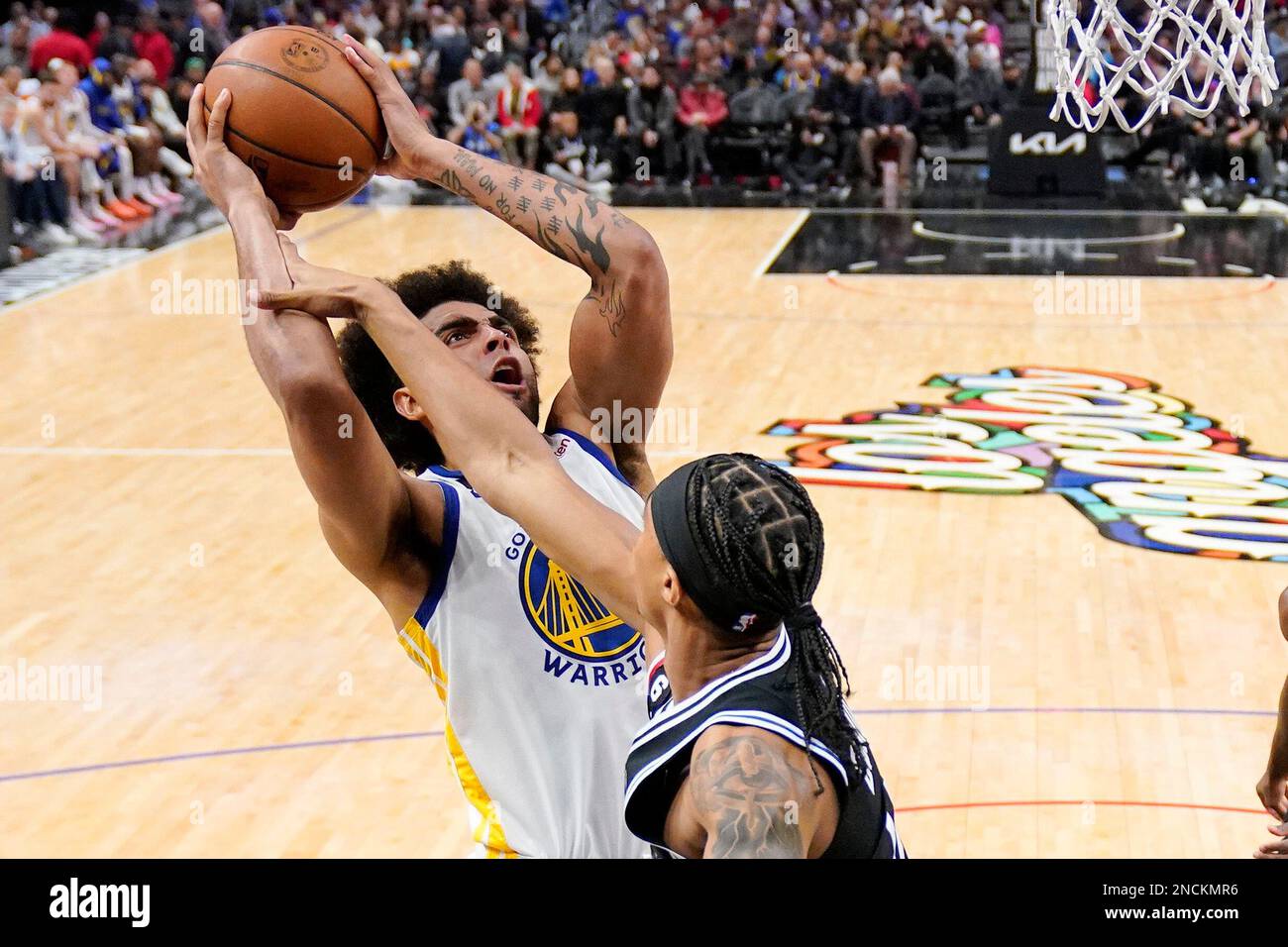 Golden State Warriors forward Anthony Lamb, left, shoots as Los Angeles ...