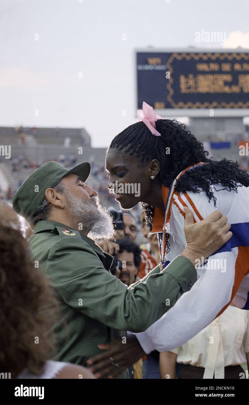 Cuban leader Fidel Castro kisses Cuban Liliana Allen on the victory ...