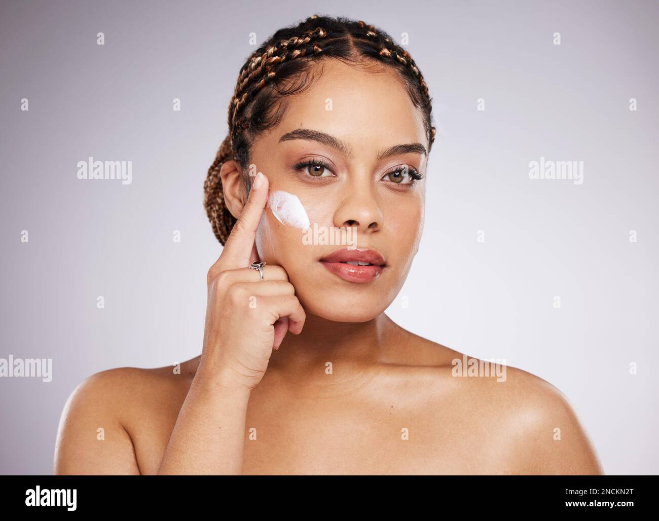 Black woman, lotion and portrait of a young model with facial mask ...