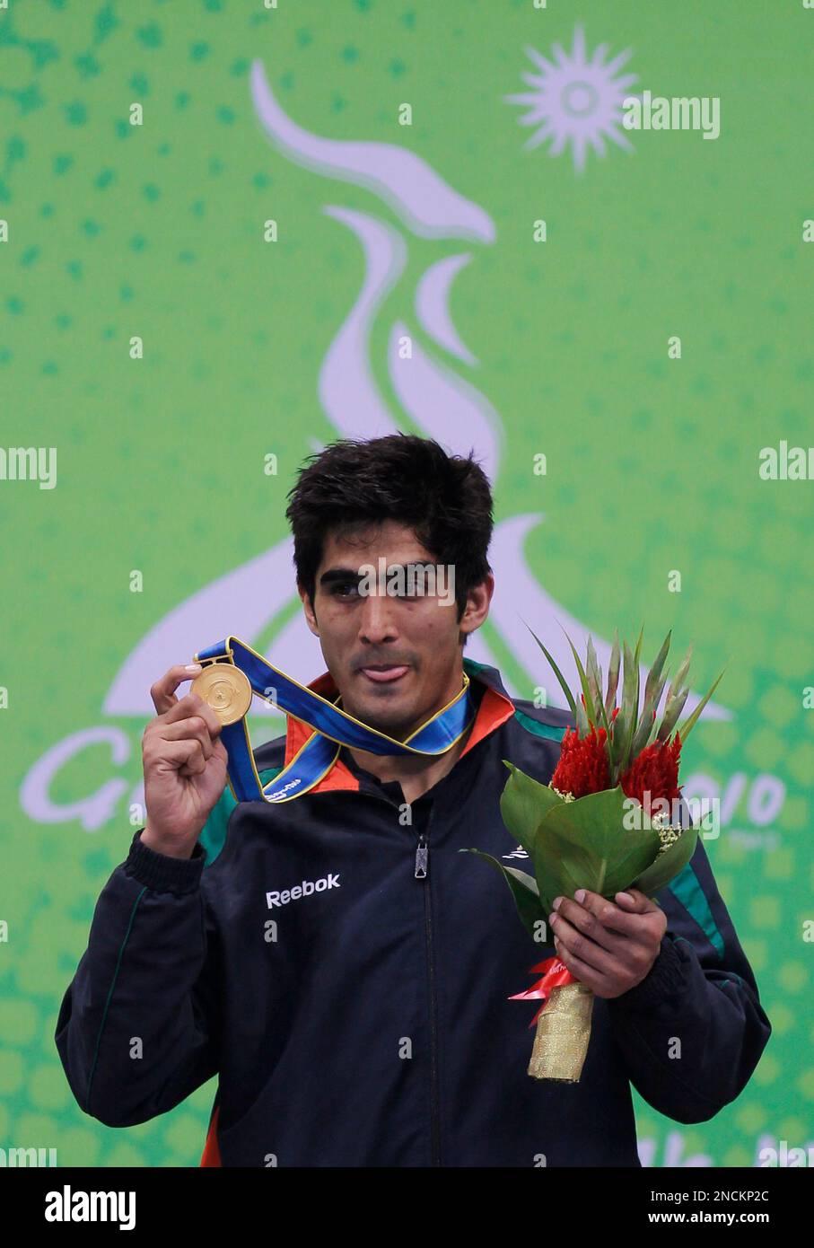 India's Vijender Singh receives his gold medal after defeated ...