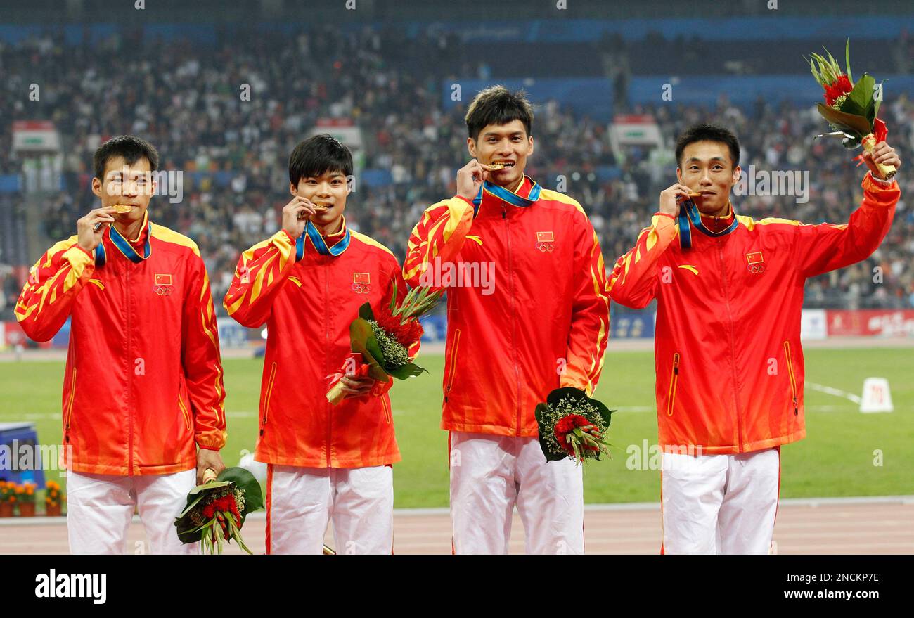 China team celebrate the gold medal they won in the men's 4x100m relay ...