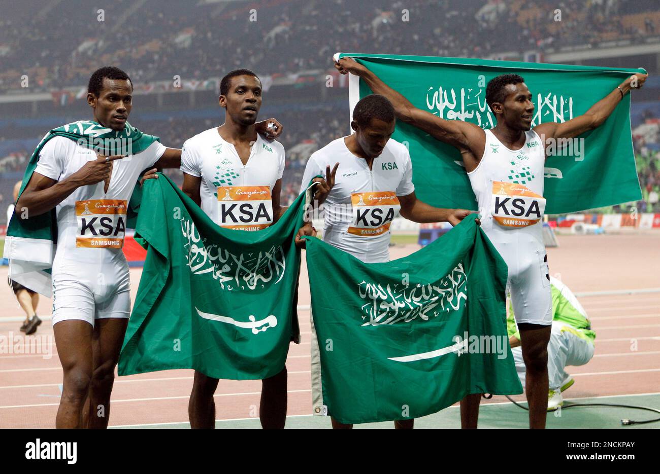 Saudi Arabia's men's 4x400 relay team celebrates after winning the gold ...