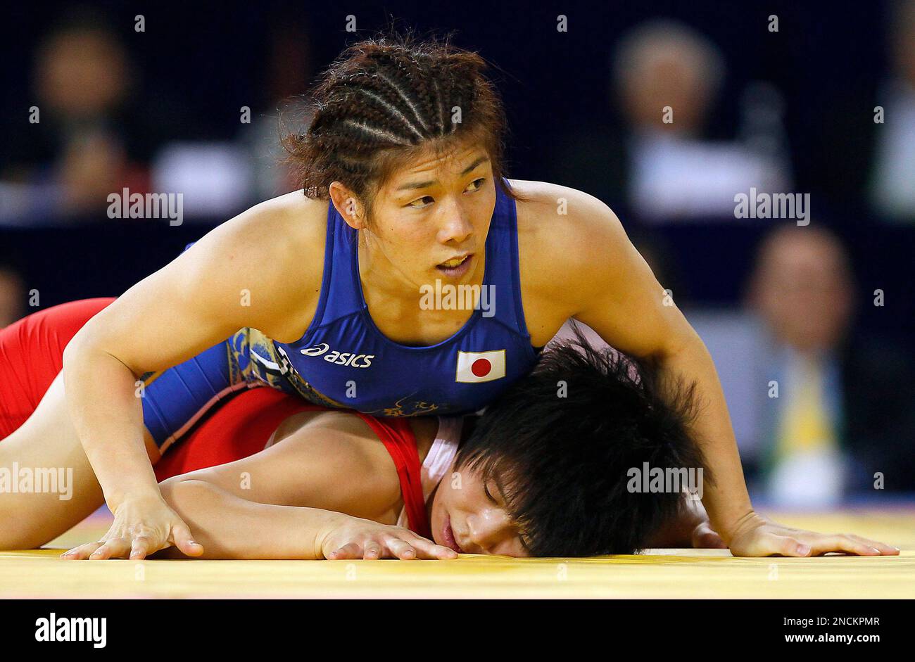 Japan's Saori Yoshida top, and Zhang Lan of China fight during the ...