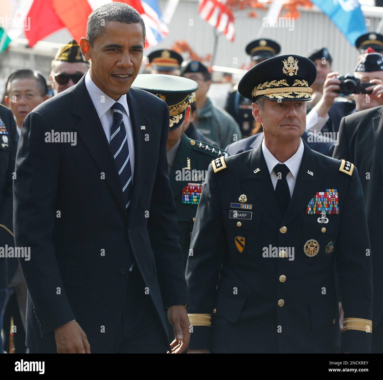 President Barack Obama walks with U.S. Forces in Korea Gen. Walter ...