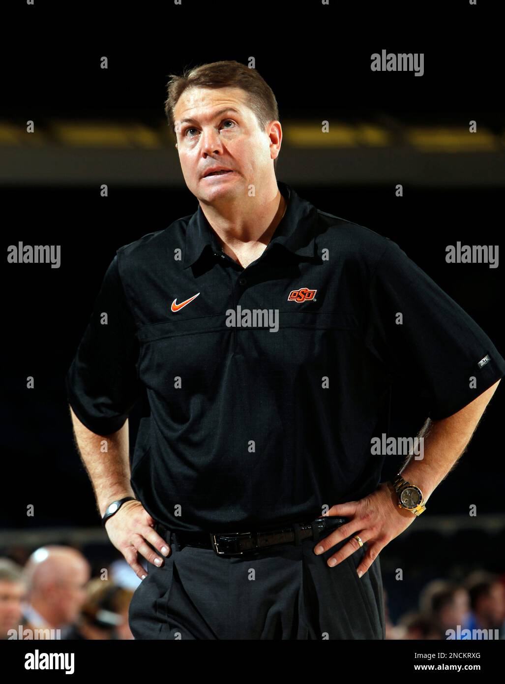 Oklahoma State coach Travis Ford looks toward the scoreboard in the ...