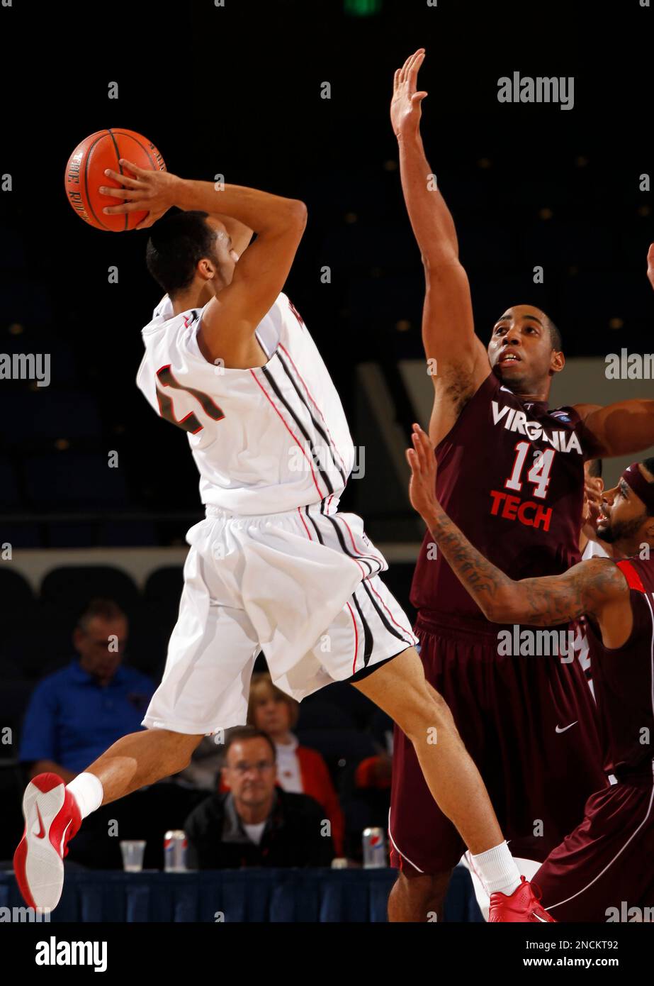 Cal State Northridge's Raymond Cody shoots over Virginia Tech defender ...