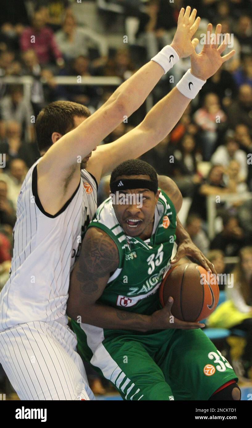 Travis Watson of Zalgiris Kaunas, right, challenges for the ball with ...