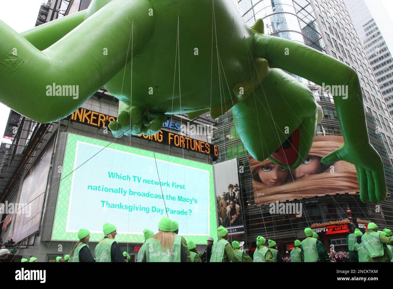 The Kermit the Frog balloon makes it's way past signage in New York's ...