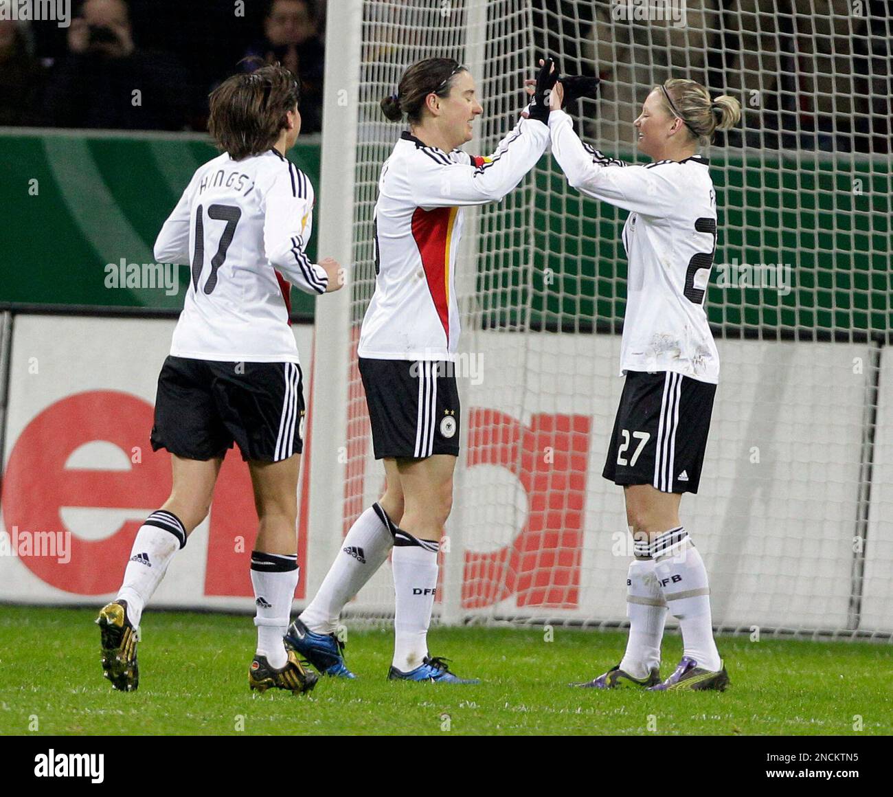 Germany's Birgit Prinz, center, celebrates with Alexandra Popp, right ...