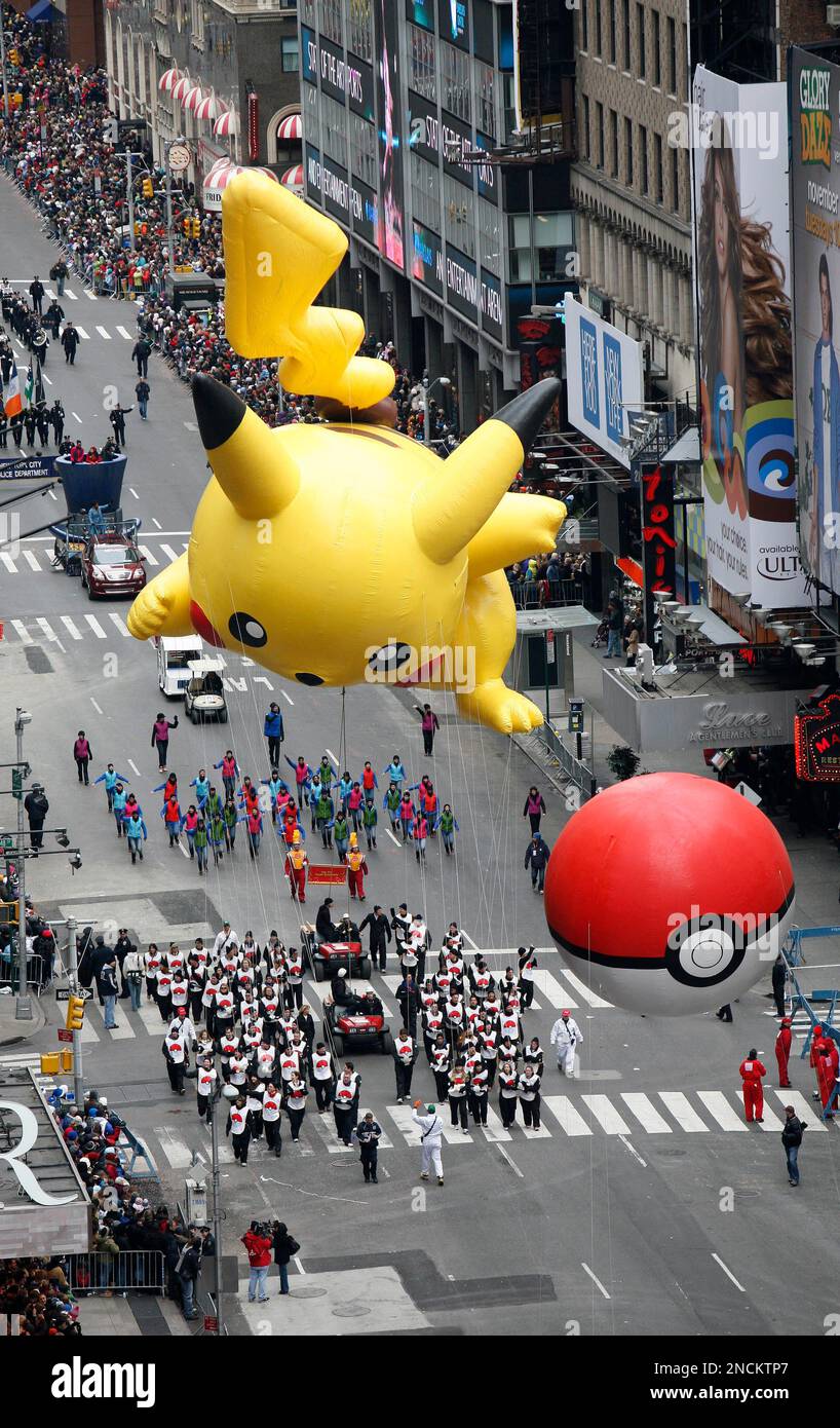 The Pikachu balloon floats through Times Square during the Macy's ...