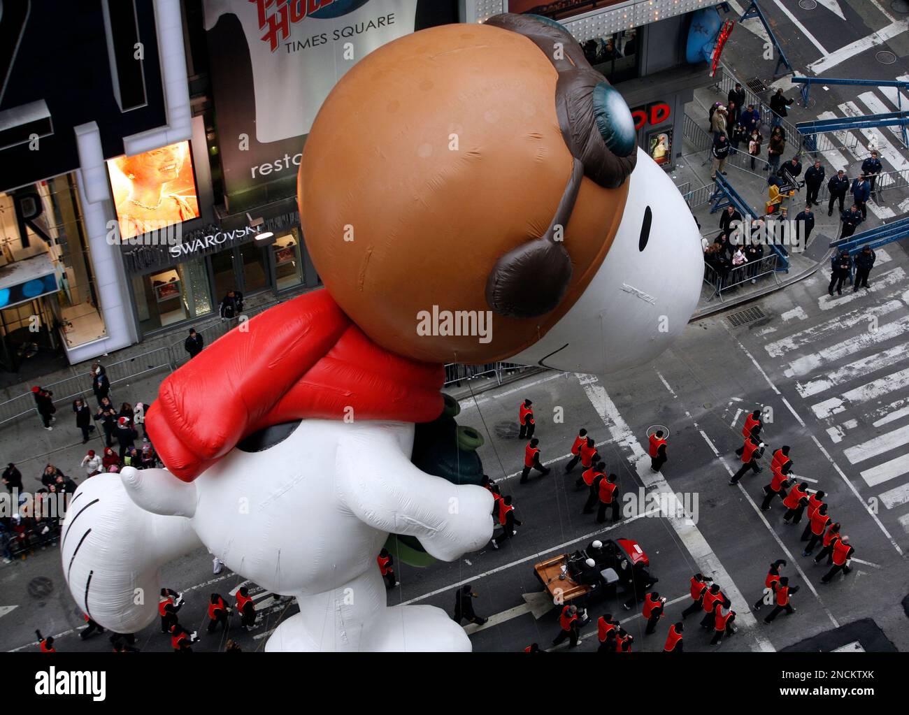 The Snoopy balloon floats through Times Square during the Macy's ...