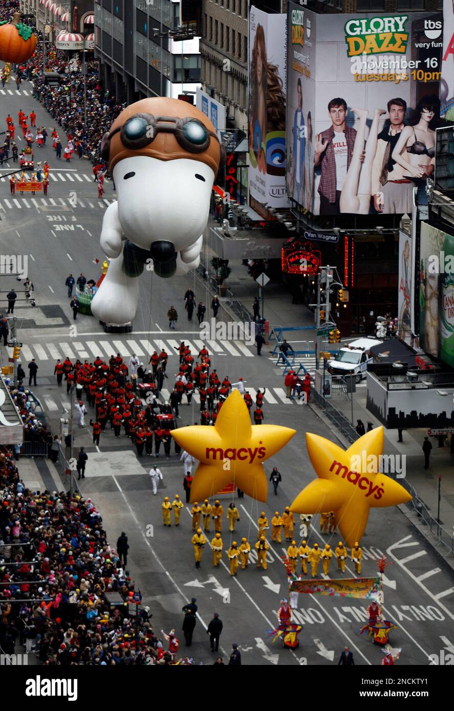 The Snoopy balloon floats through Times Square during the Macy's ...