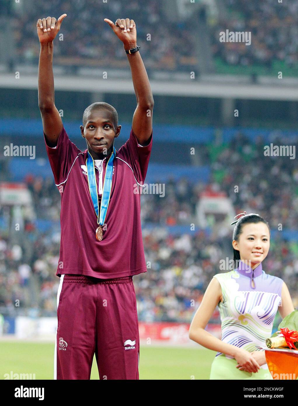 Qatar's Abdelrahman Musaab Bala poses with the bronze medal he won in ...