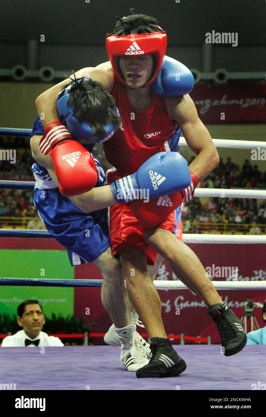 Chang Yong of China, right, and Rey Saludar of Philippines, left, fight ...