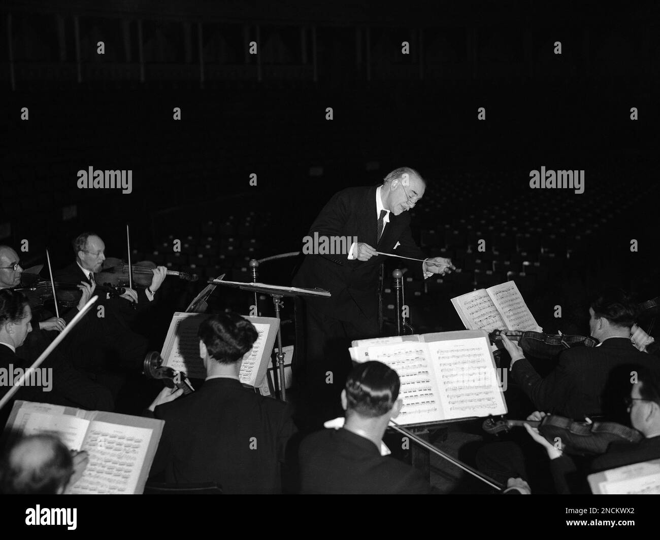English conductor Sir Thomas Beecham conducts the Royal Philharmonic ...