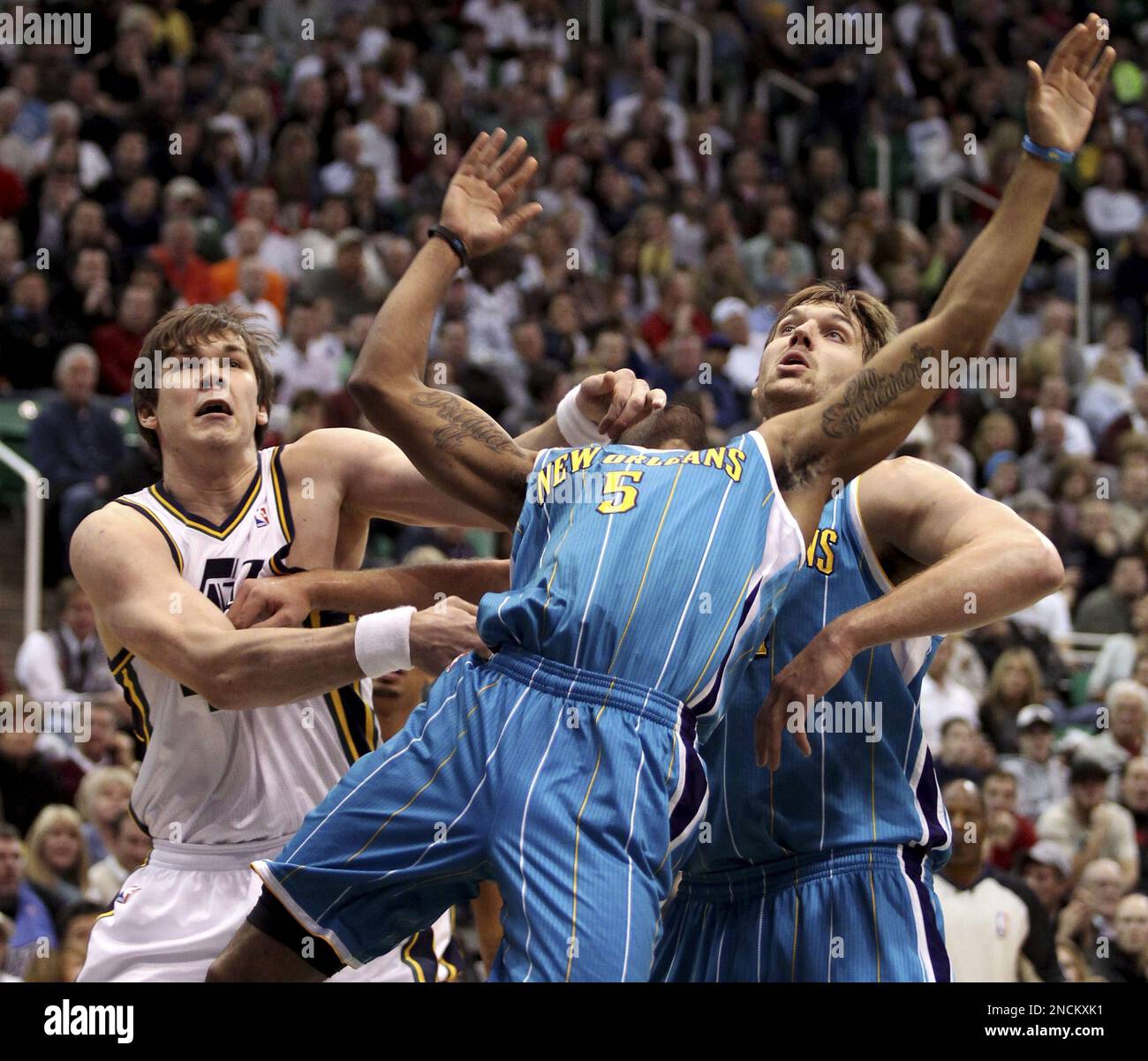Utah Jazz center Kyrylo Fesenko, left, of Ukraine, fouls New Orleans ...