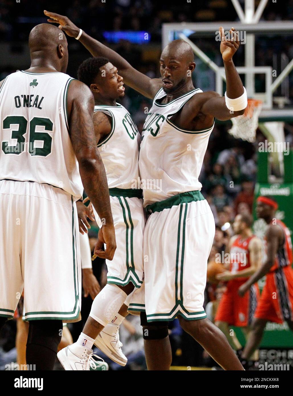Boston Celtics' Kevin Garnett, right, bumps chests with Nate Robinson ...