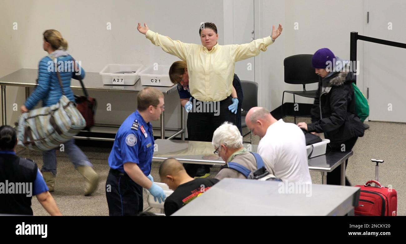 A passenger undergoes a TSA pat-down, Wednesday, Nov. 24, 2010, at ...