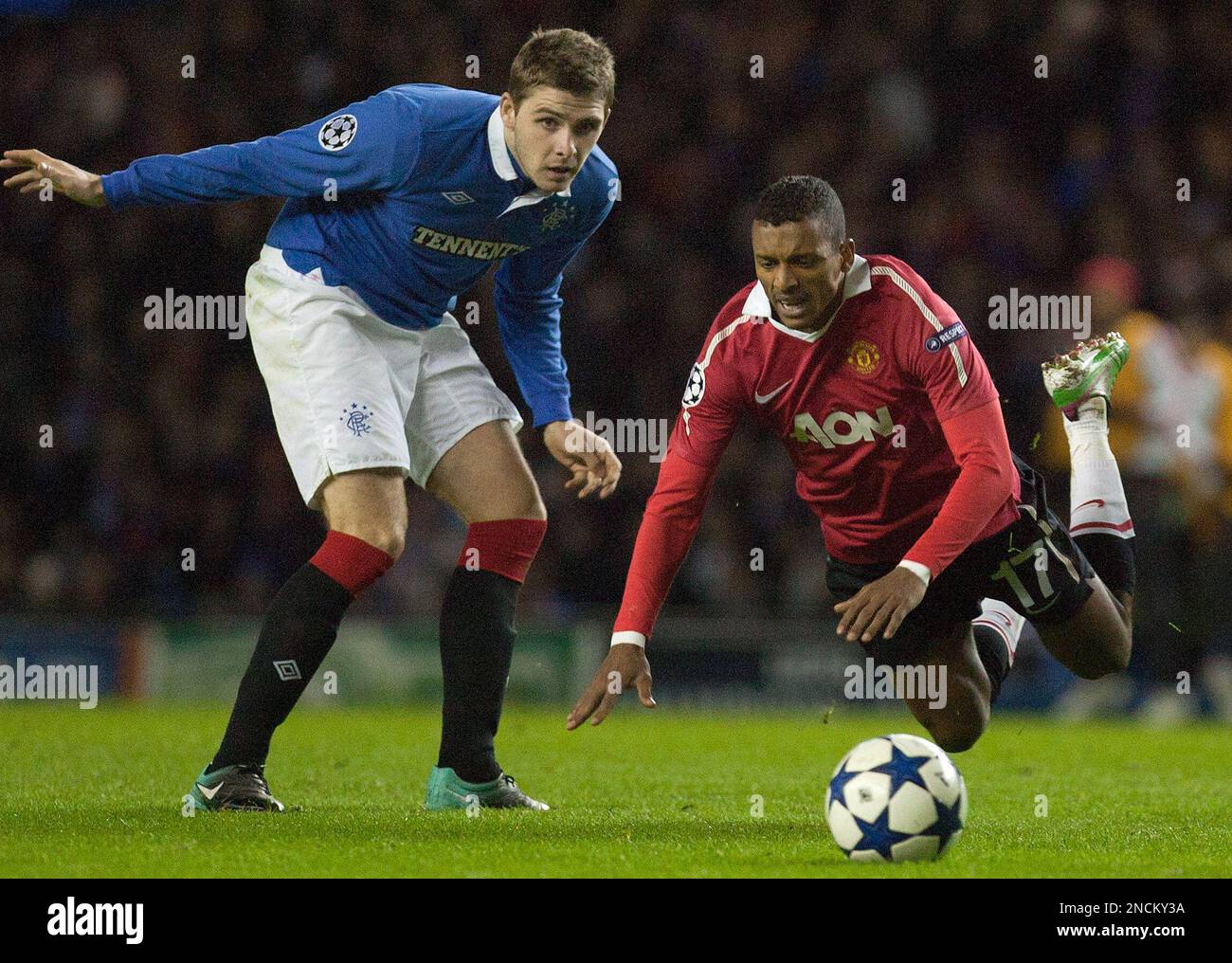 Glasgow Rangers' Kyle Hutton, left, looks on as Manchester United's ...