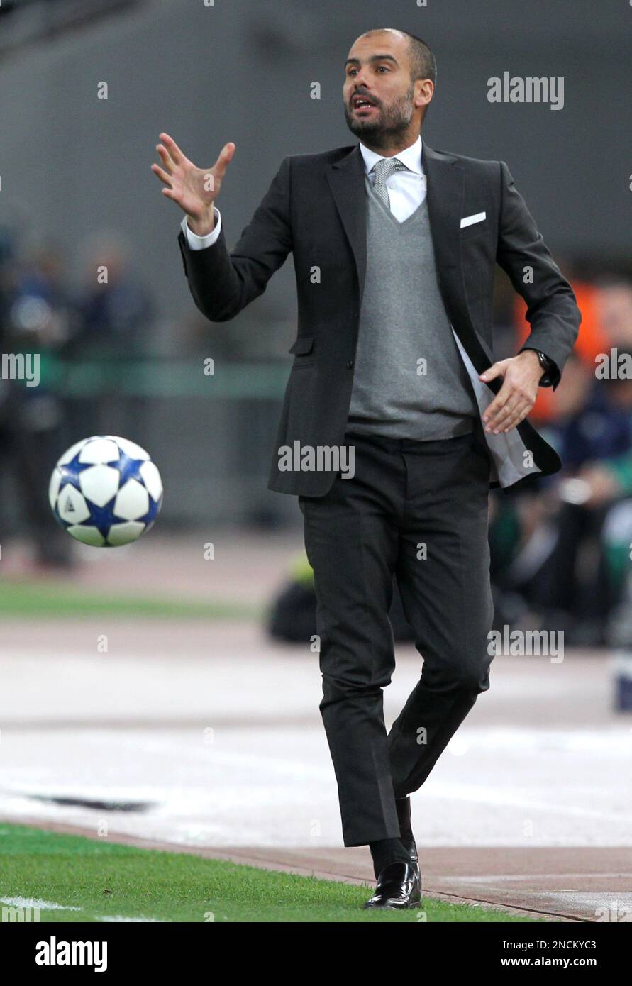 Barcelona's coach Josep Guardiola gives instructions to his players ...