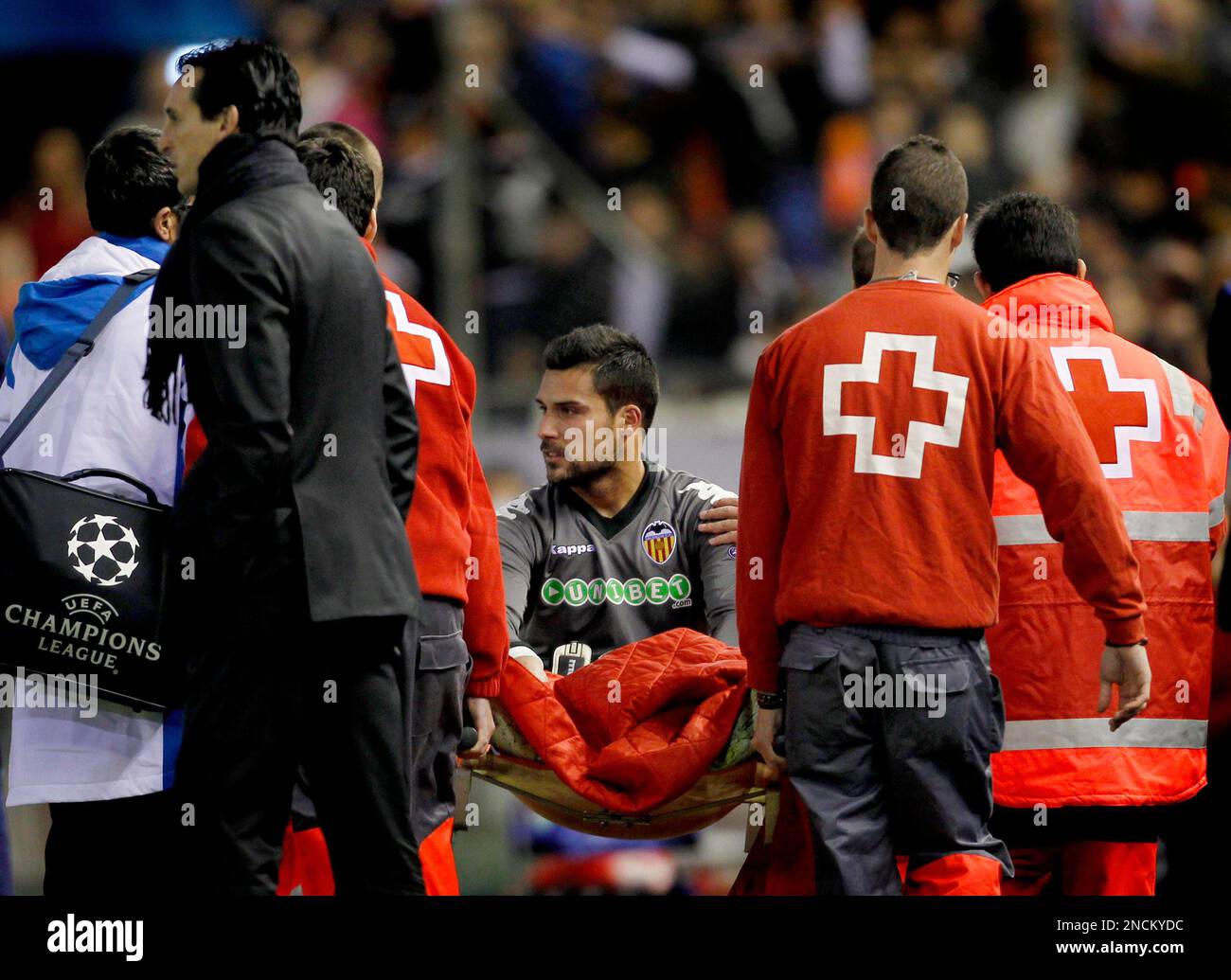 Valencia's goalkeeper Miguel Angel Moya from Spain, center, is carried ...