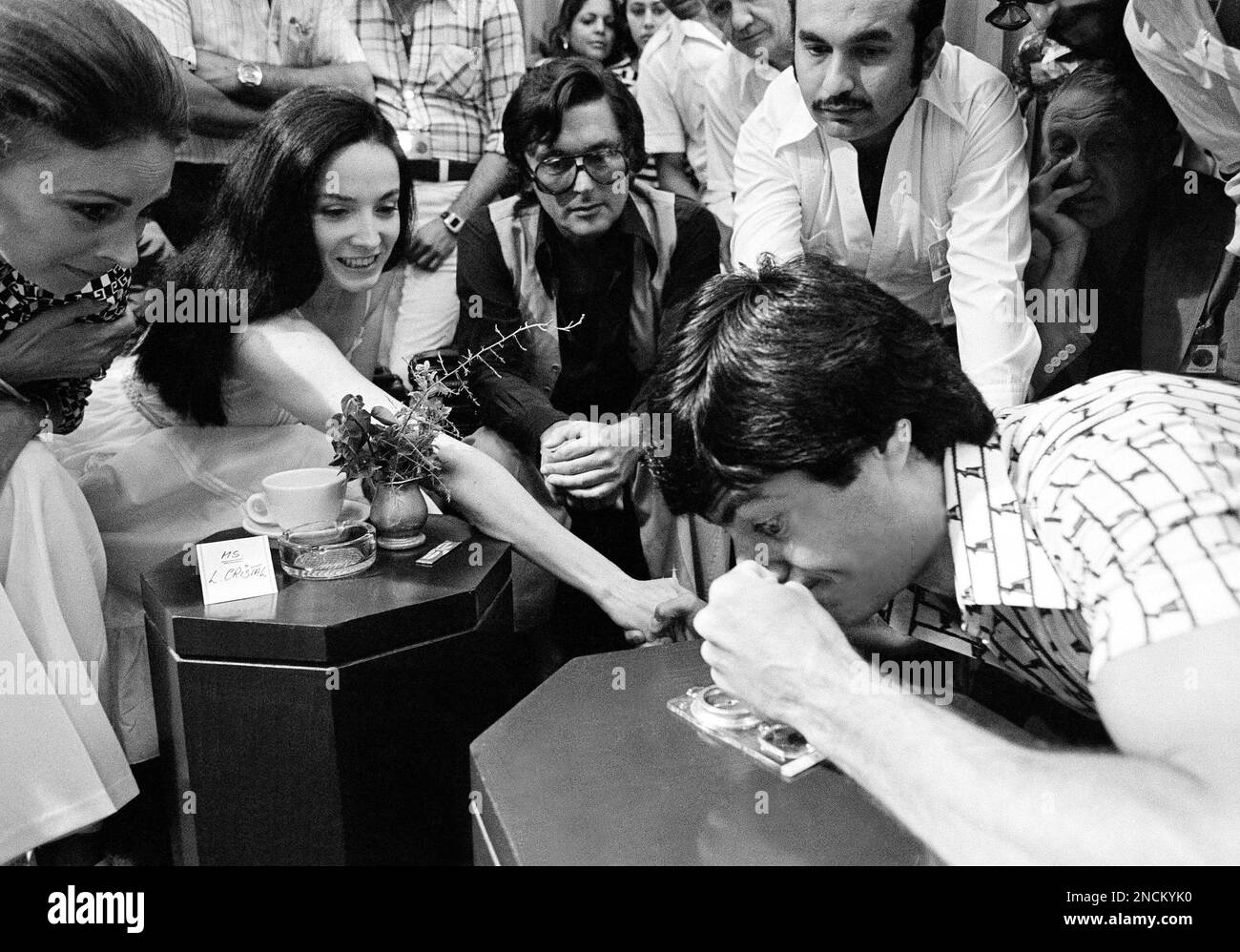Telepathic and psychokineticist Uri Geller, right, struggles to ...