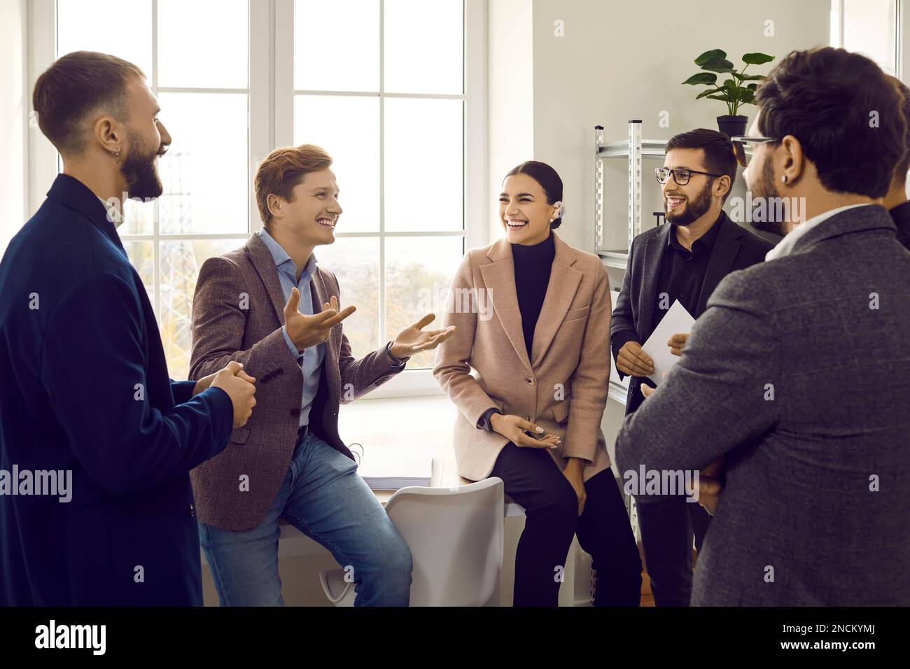Group of business people chatting after a meeting. Company employees ...