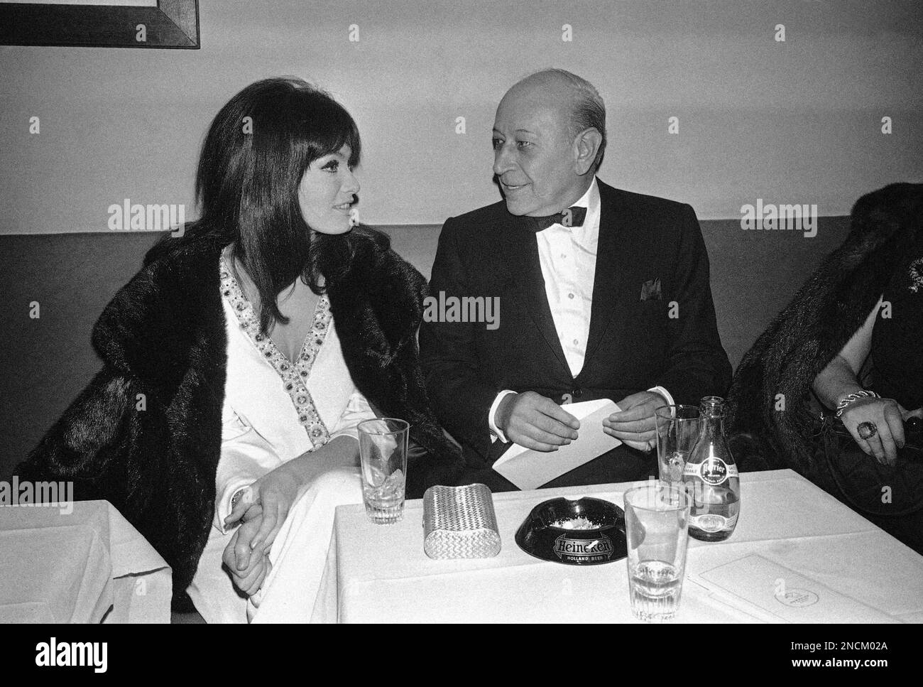 Actress Marisa Mell and veteran Hollywood actor George Raft relax at ...