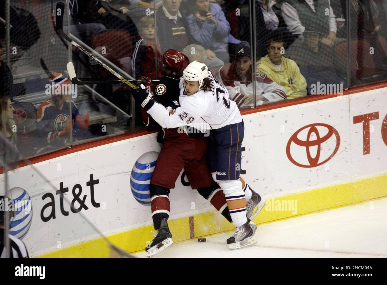 Edmonton Oilers' Ryan Jones, right, against Phoenix Coyotes' David ...