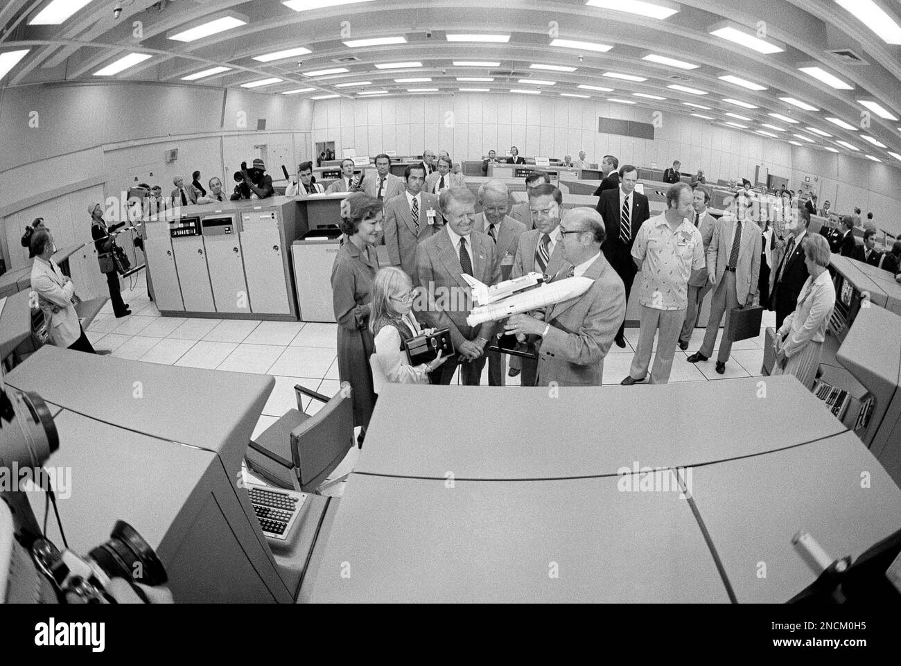 NASA administrator Dr. Robert Froscoch, right, shows model of the space ...