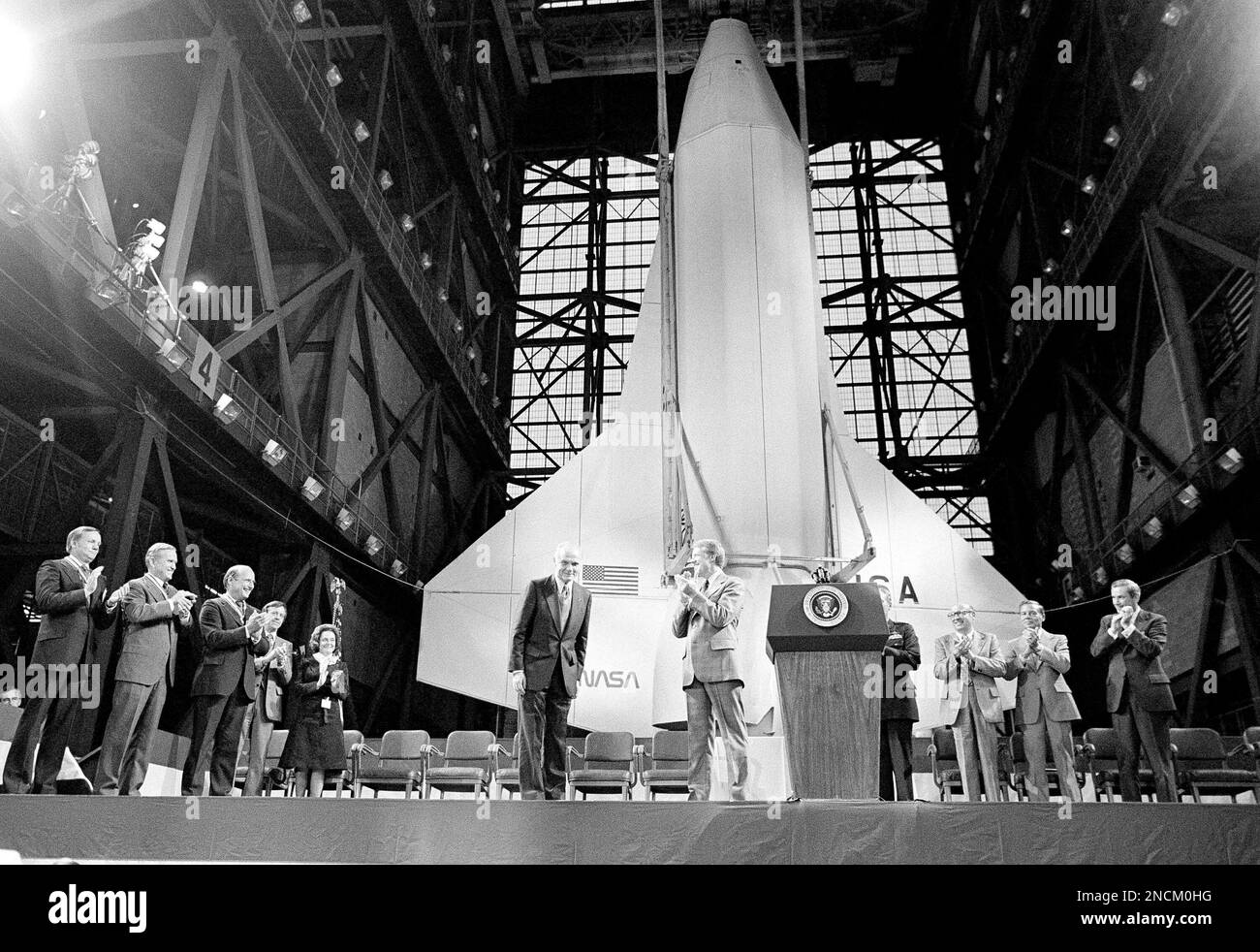 Former astronaut John Glenn bows as he is introduced by President Jimmy ...