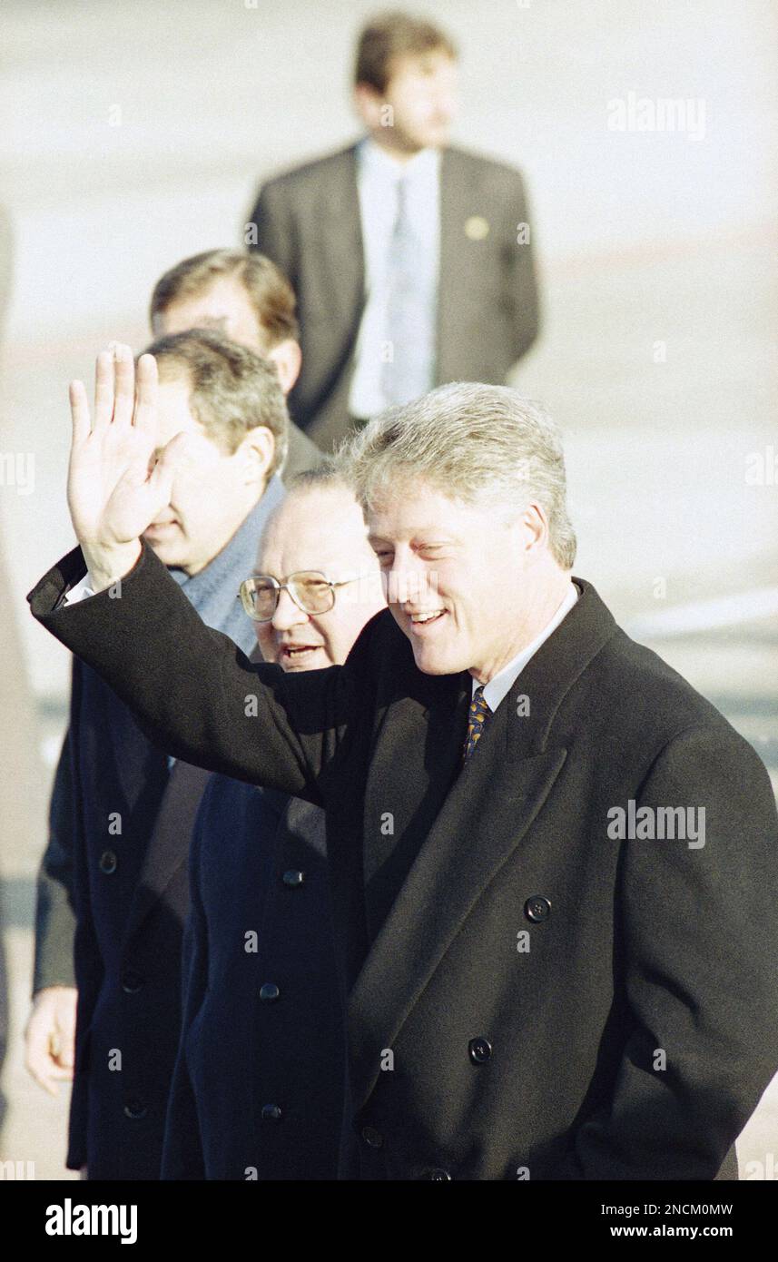 President Bill Clinton waves to the crowd gathered at the main Brussels ...