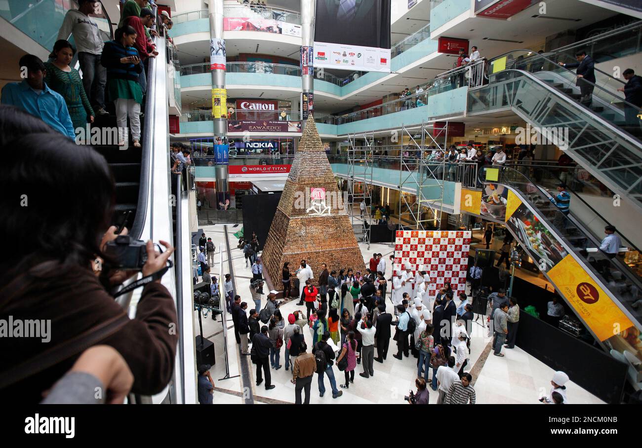 People look at the 26 feet (8 meter) chocolate eclair pyramid that was ...